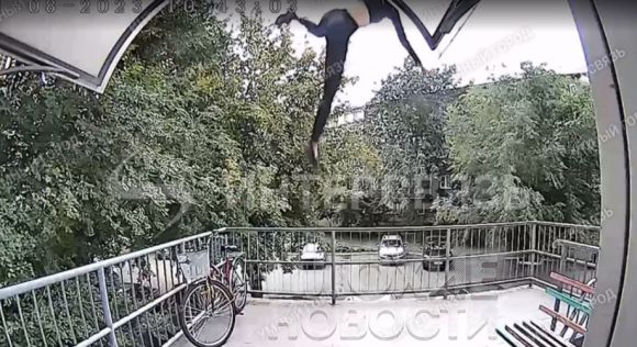 Russian woman falls from tall building.